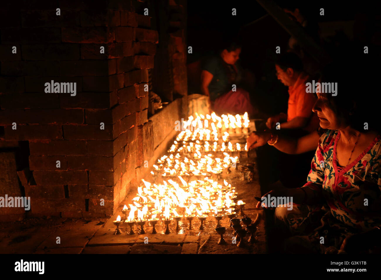 Kathmandu, Nepal. 15th Apr, 2016. Hindu devotees lighten butter lamps ...