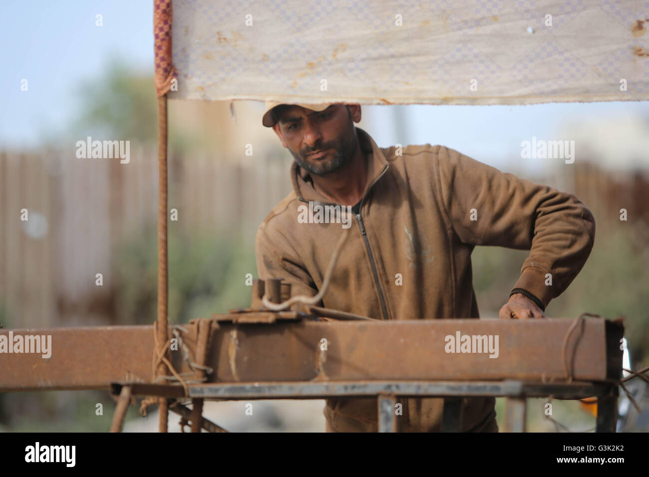 Gaza, Palestine. 24th Mar, 2016. Palestinian worker works at an iron ...