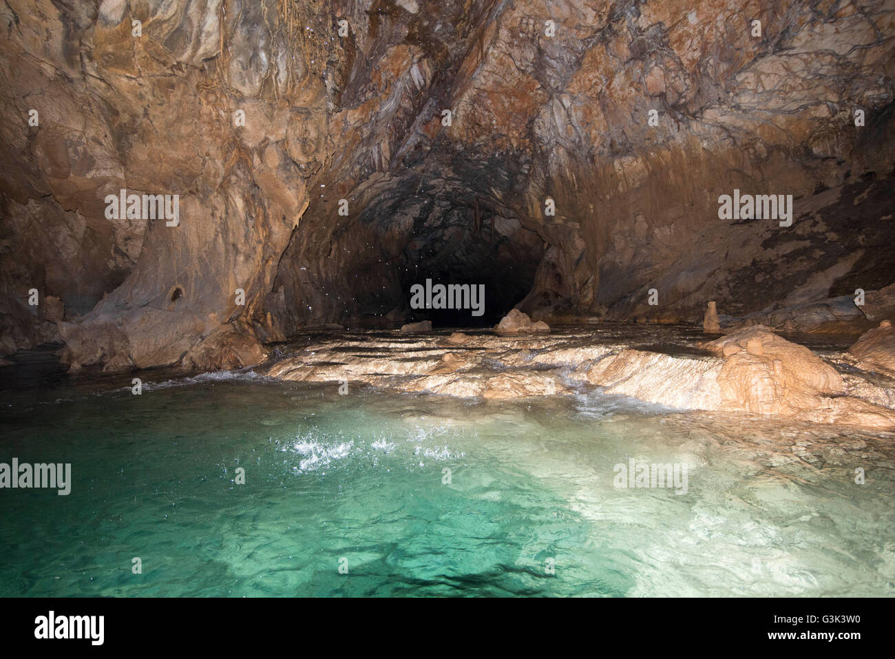 Exploring the cave Stock Photo - Alamy