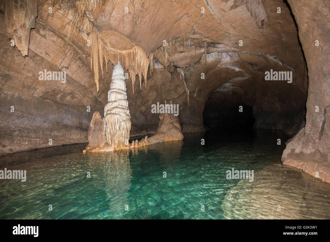 Exploring the cave Stock Photo - Alamy