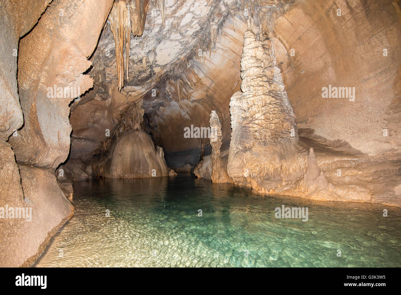 Exploring the cave Stock Photo - Alamy