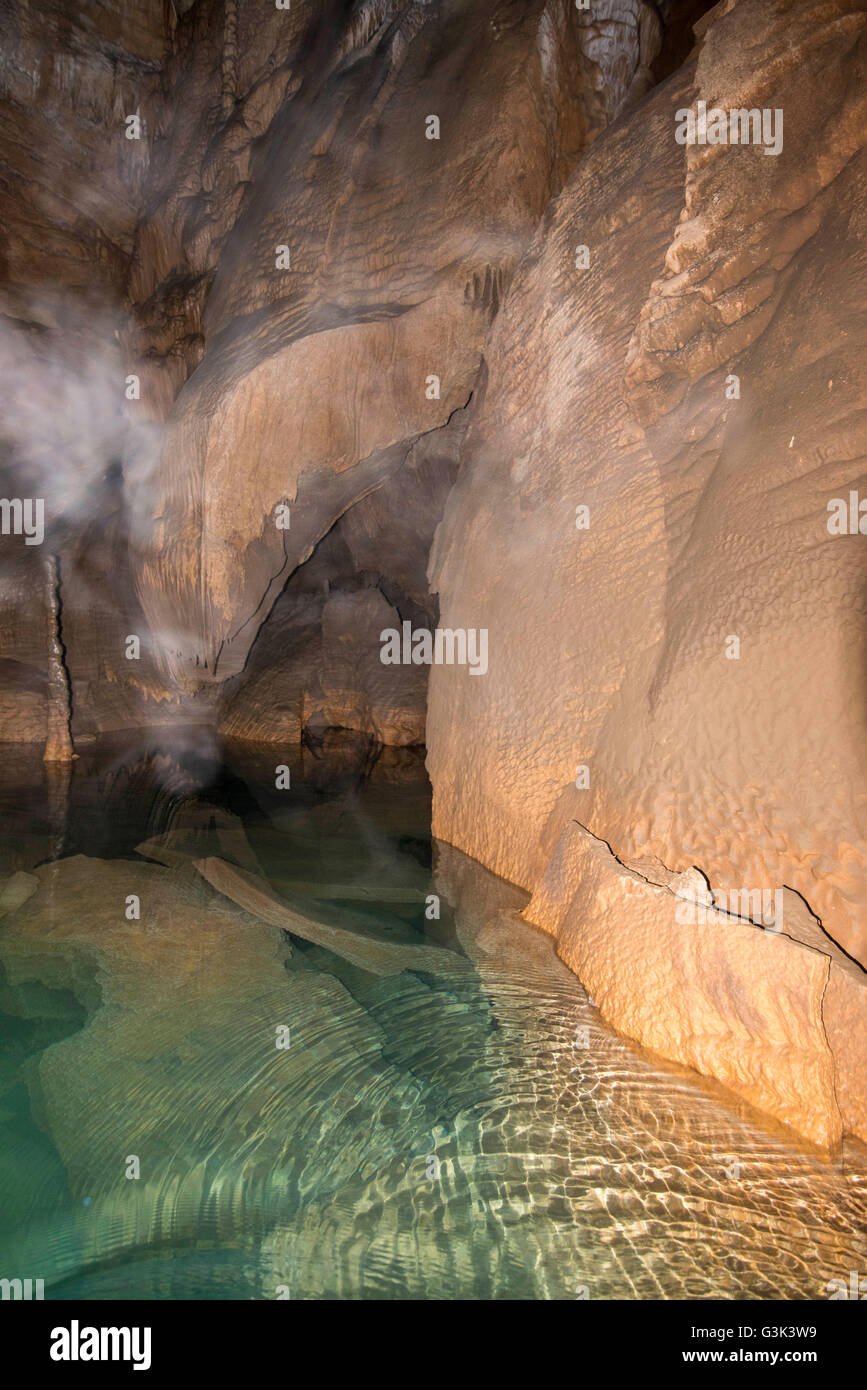 Exploring the cave Stock Photo - Alamy