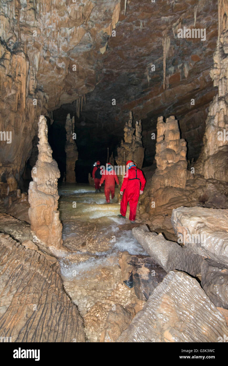 Exploring the cave Stock Photo - Alamy