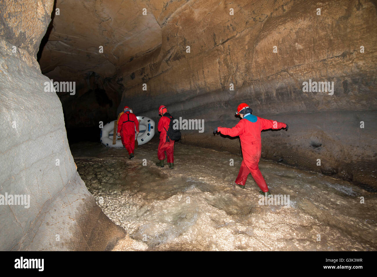 Exploring the cave Stock Photo - Alamy