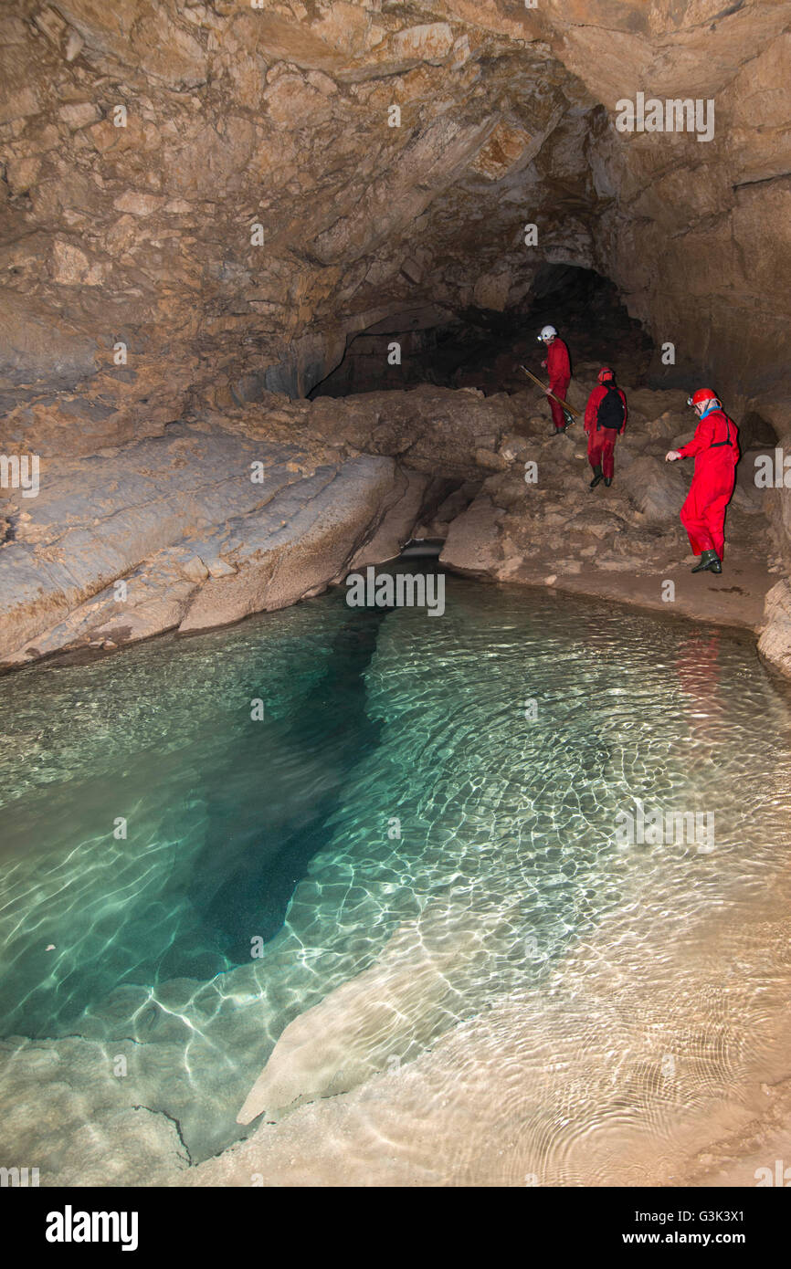 Exploring the cave Stock Photo - Alamy