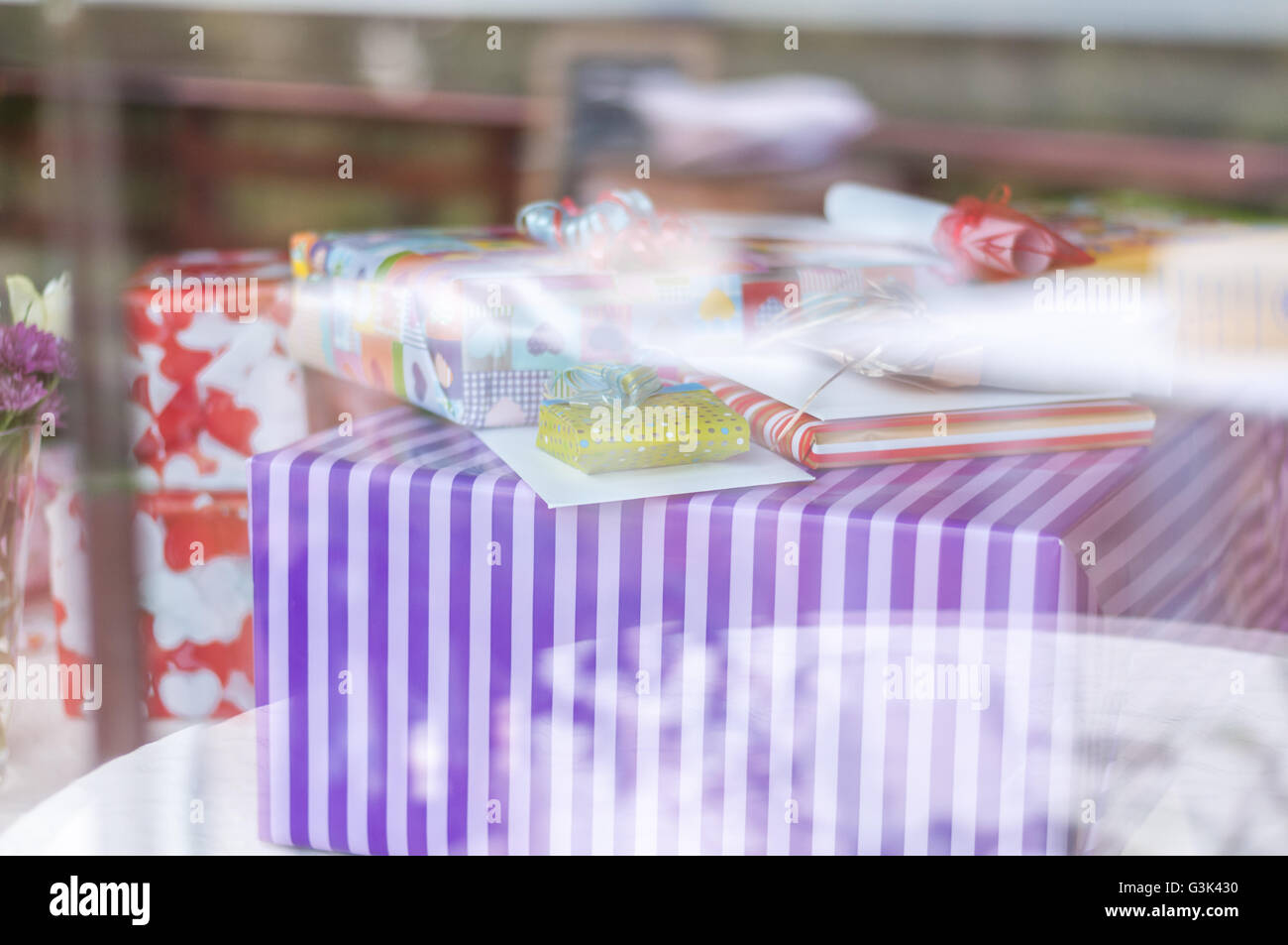 Gifts behind windowpane Stock Photo - Alamy