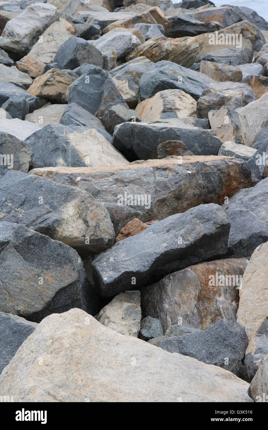 Beach with rock jetty hi-res stock photography and images - Alamy