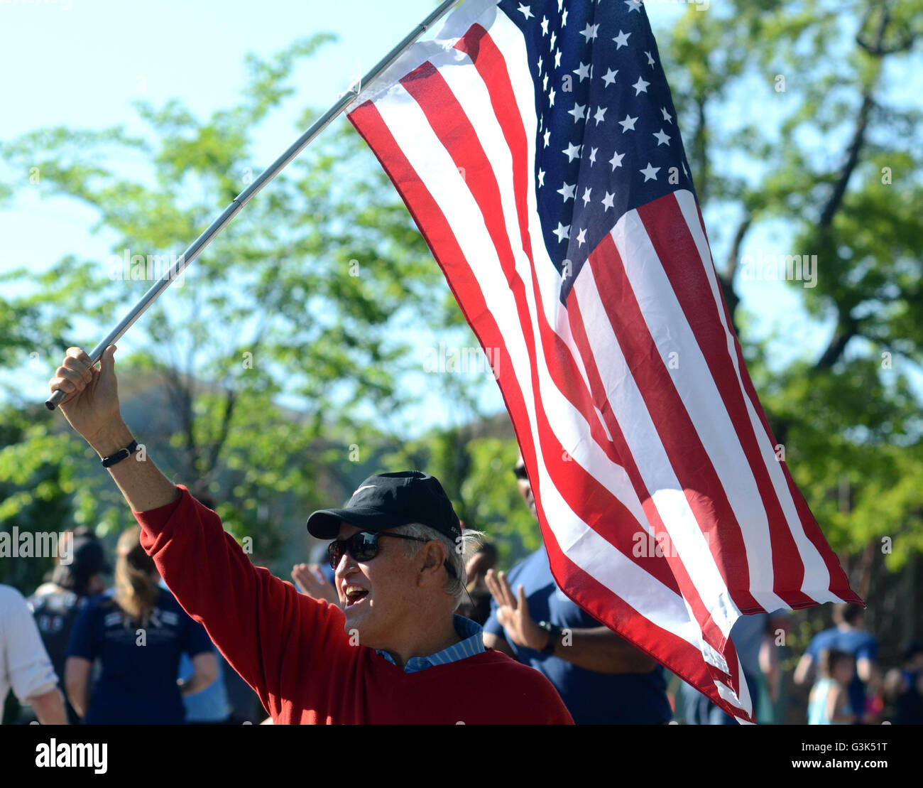 American athletes waving american flags hi-res stock photography and ...