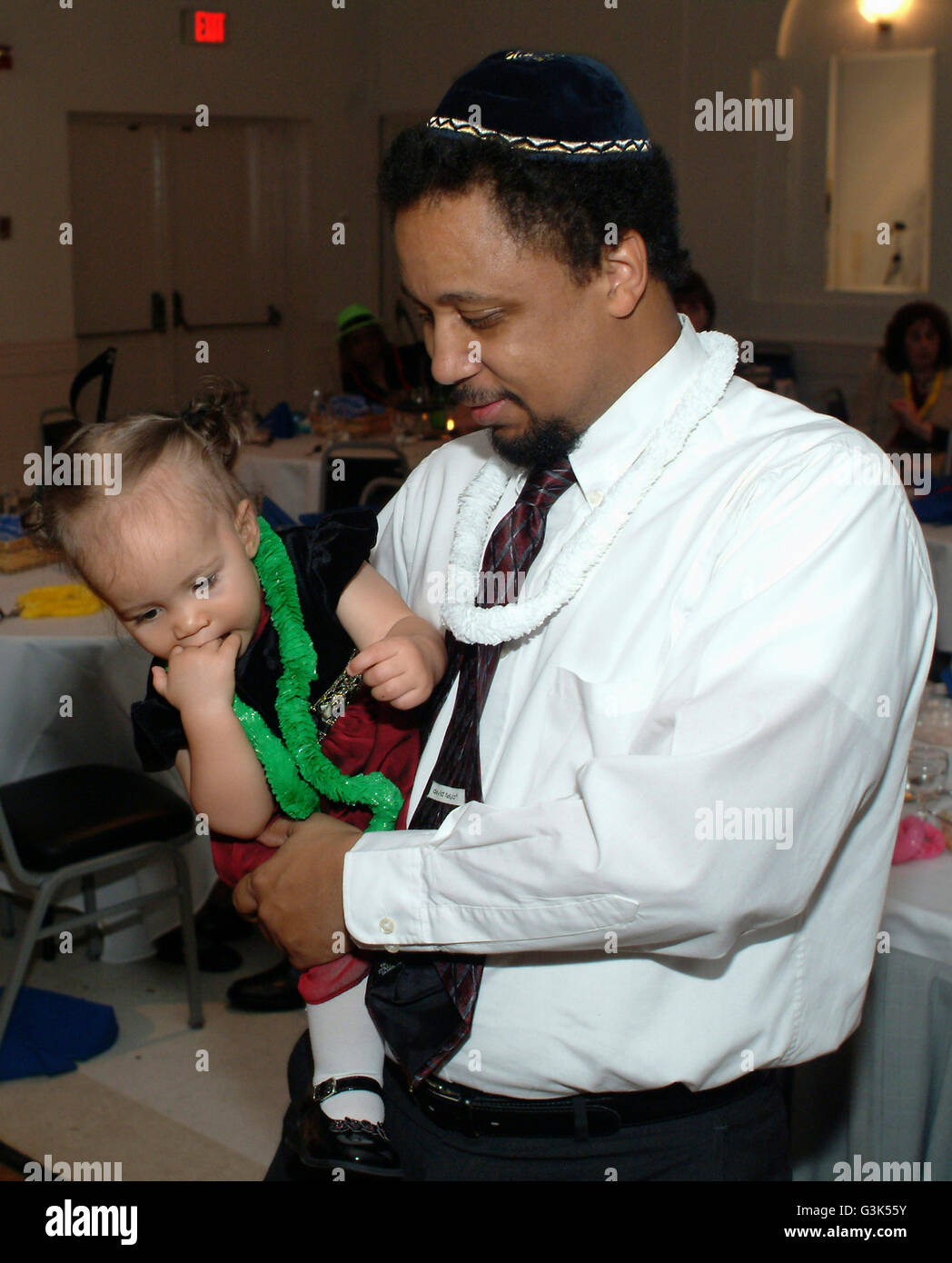 A Jewish African American with a baby child Stock Photo - Alamy
