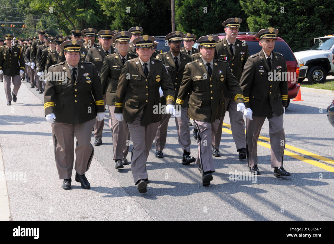 Montgomery County , Maryland Police march down the street to take a ...