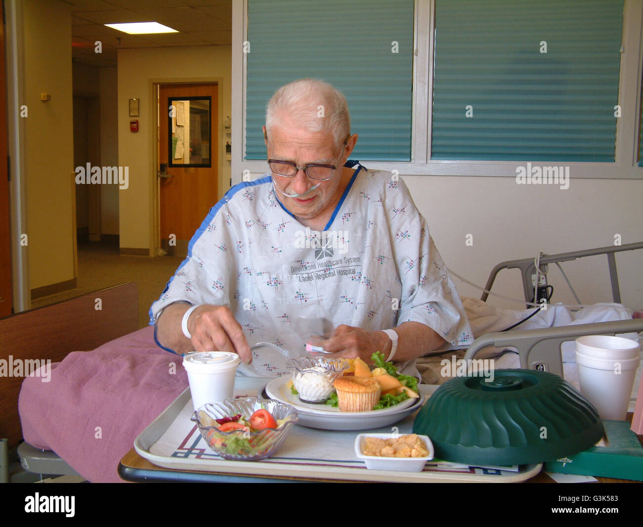 man eating hospital food while recuperating in a hospital from heart ...