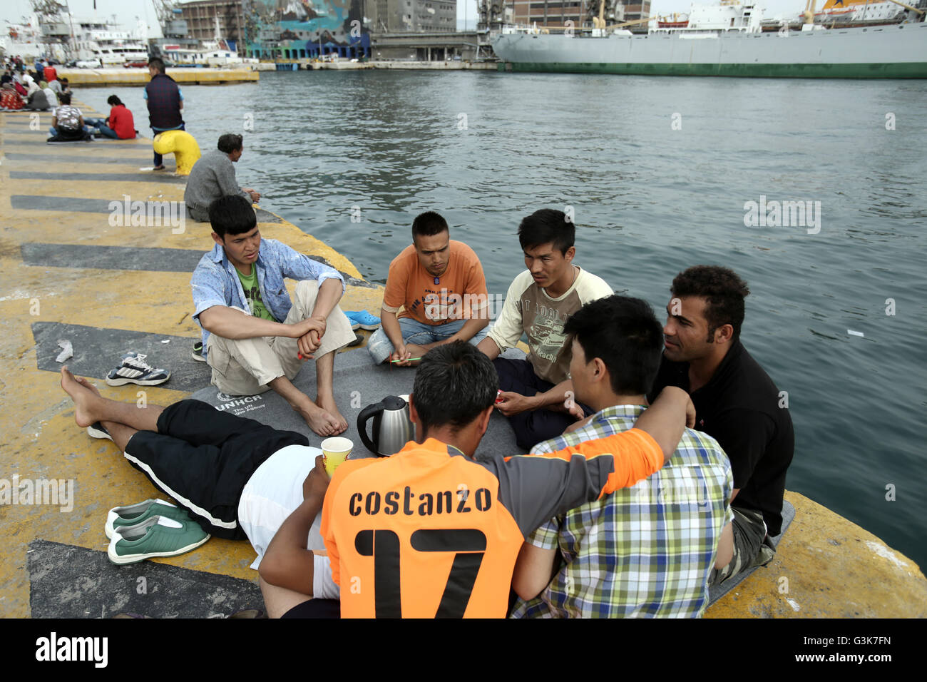 Piraeus, Greece. 07th Apr, 2016. Men at the dock of Piraeus port near ...