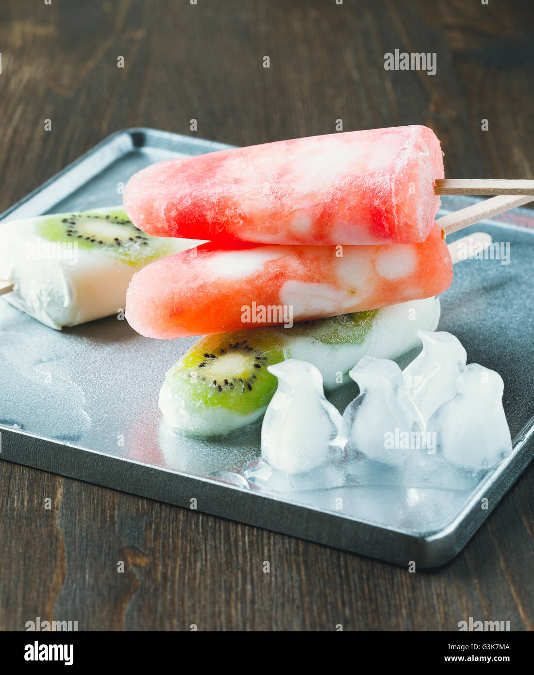 Homemade fruit juice popsicles with a stick. Vanilla ice cream with ...