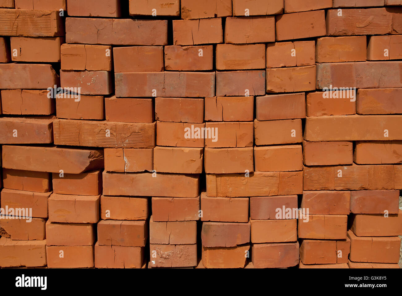 lots of some orange bricks creating an orange texture Stock Photo - Alamy