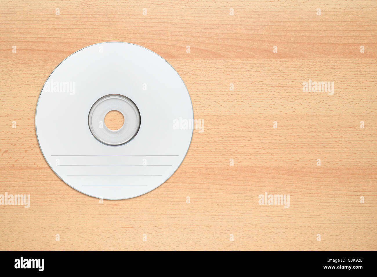 White compact disc on office desk top view Stock Photo - Alamy