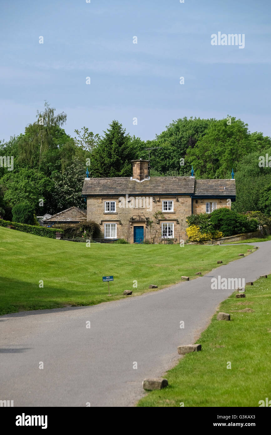 Road through the pretty Derbyshire village of Edensor Stock Photo - Alamy