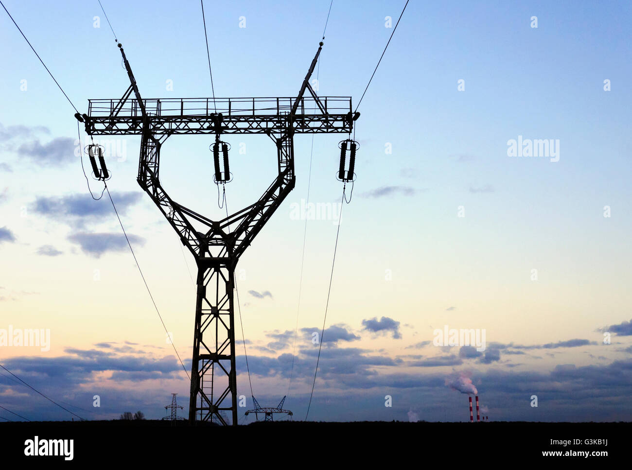 Power line on sunset sky background Stock Photo - Alamy
