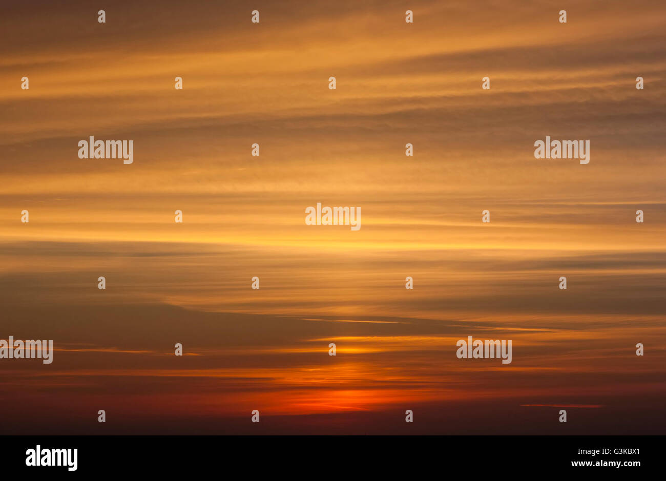 Yellow and orange dramatic sunset sky Stock Photo - Alamy