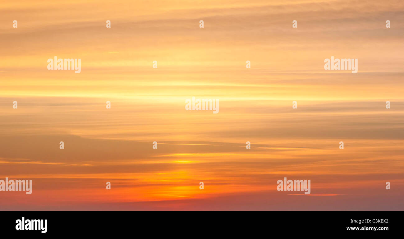 Yellow and orange dramatic sunset sky Stock Photo - Alamy