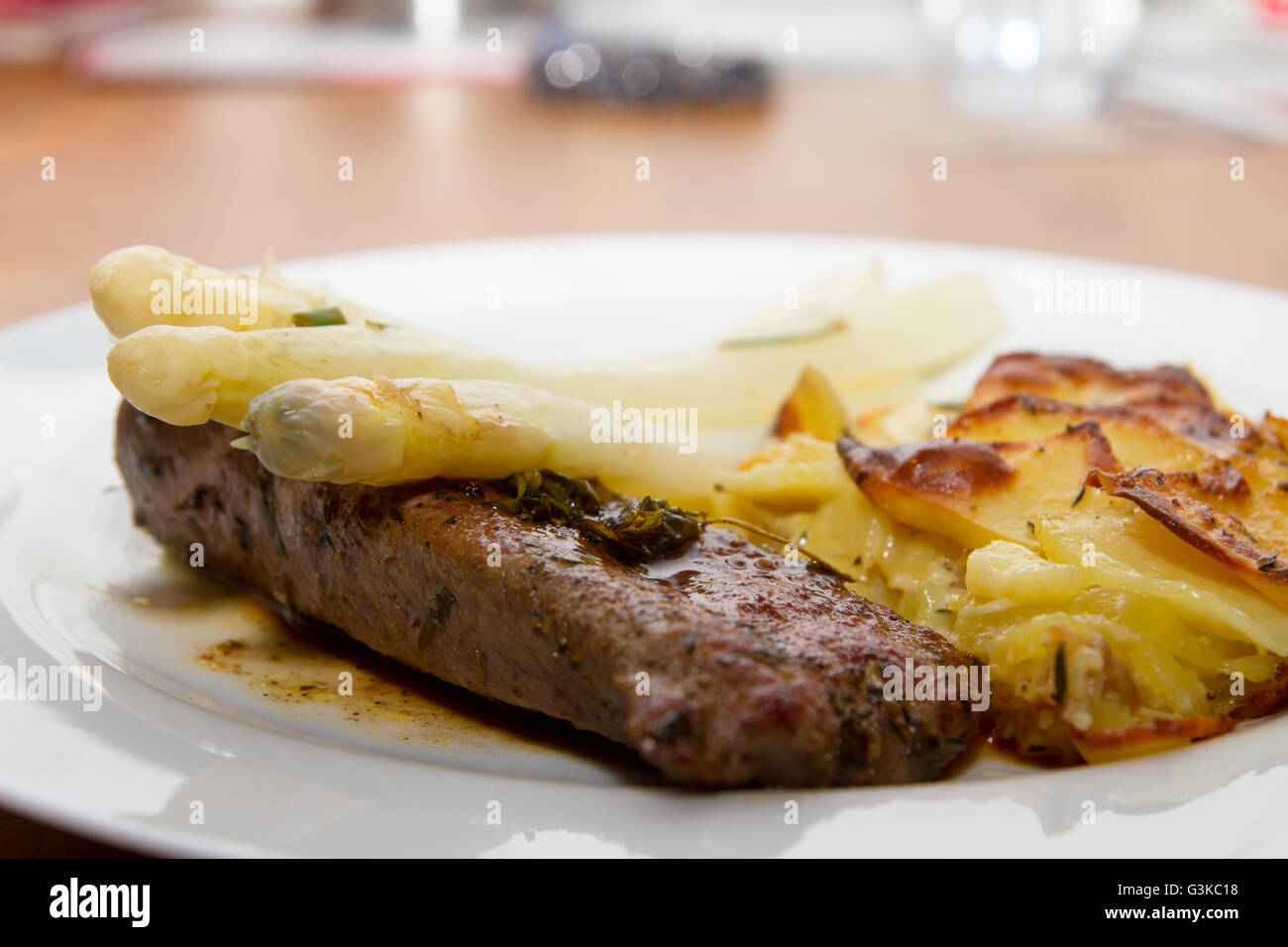 Lamb fillet with potato and asparagus Stock Photo - Alamy