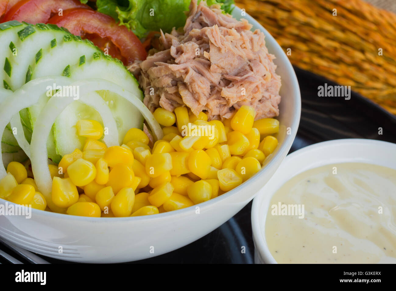 Fresh colorful salad with dressing Stock Photo - Alamy