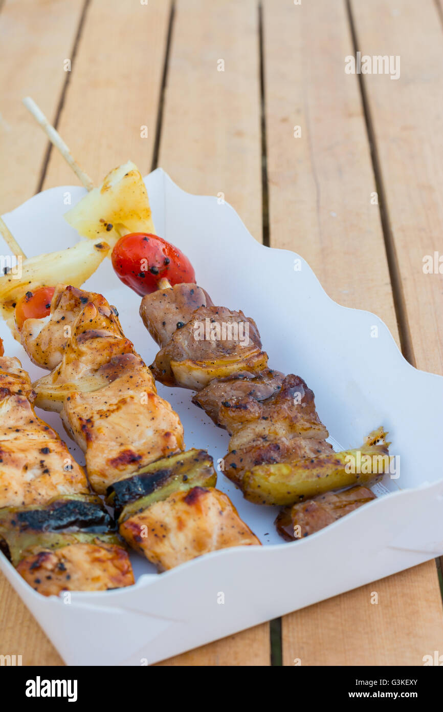 Street food BBQ on wood table background Stock Photo - Alamy