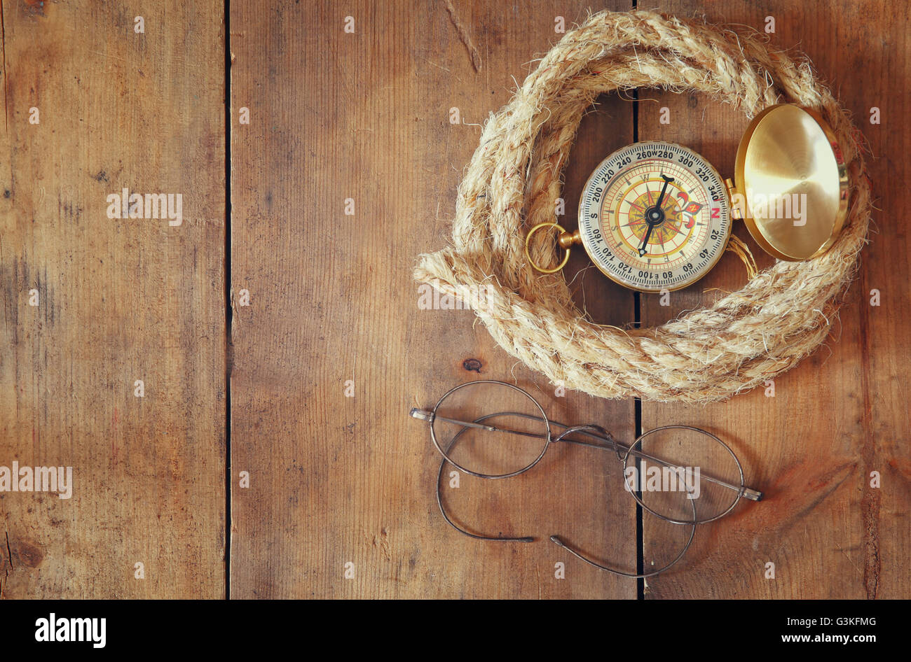 top view of compass, rope, old glasses. explorer and adventure concept ...