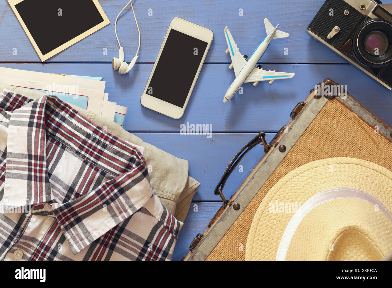 traveling concept with clothes ready to be packed. top view. instant ...