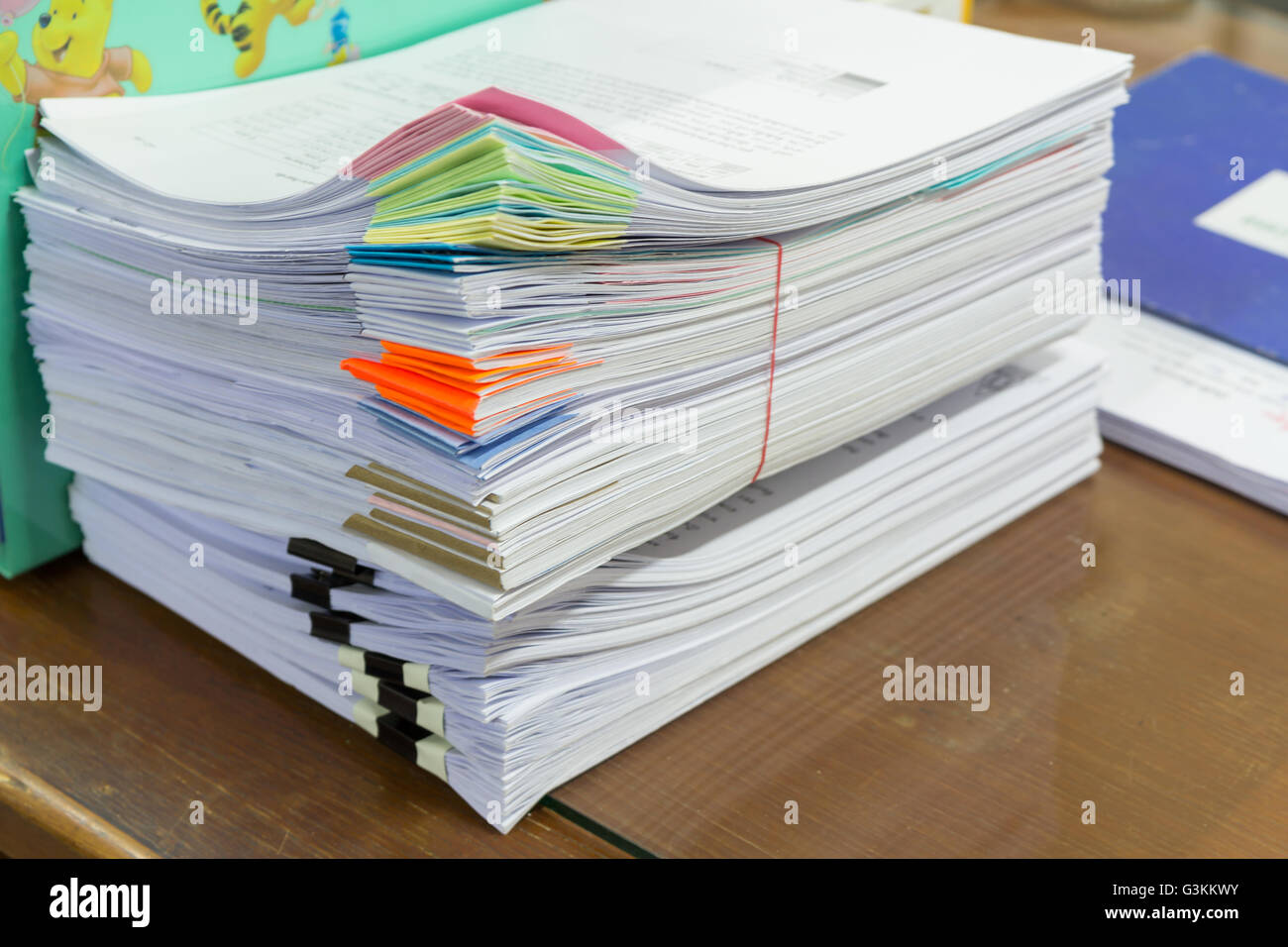 Stack of business papers on office desk Stock Photo - Alamy