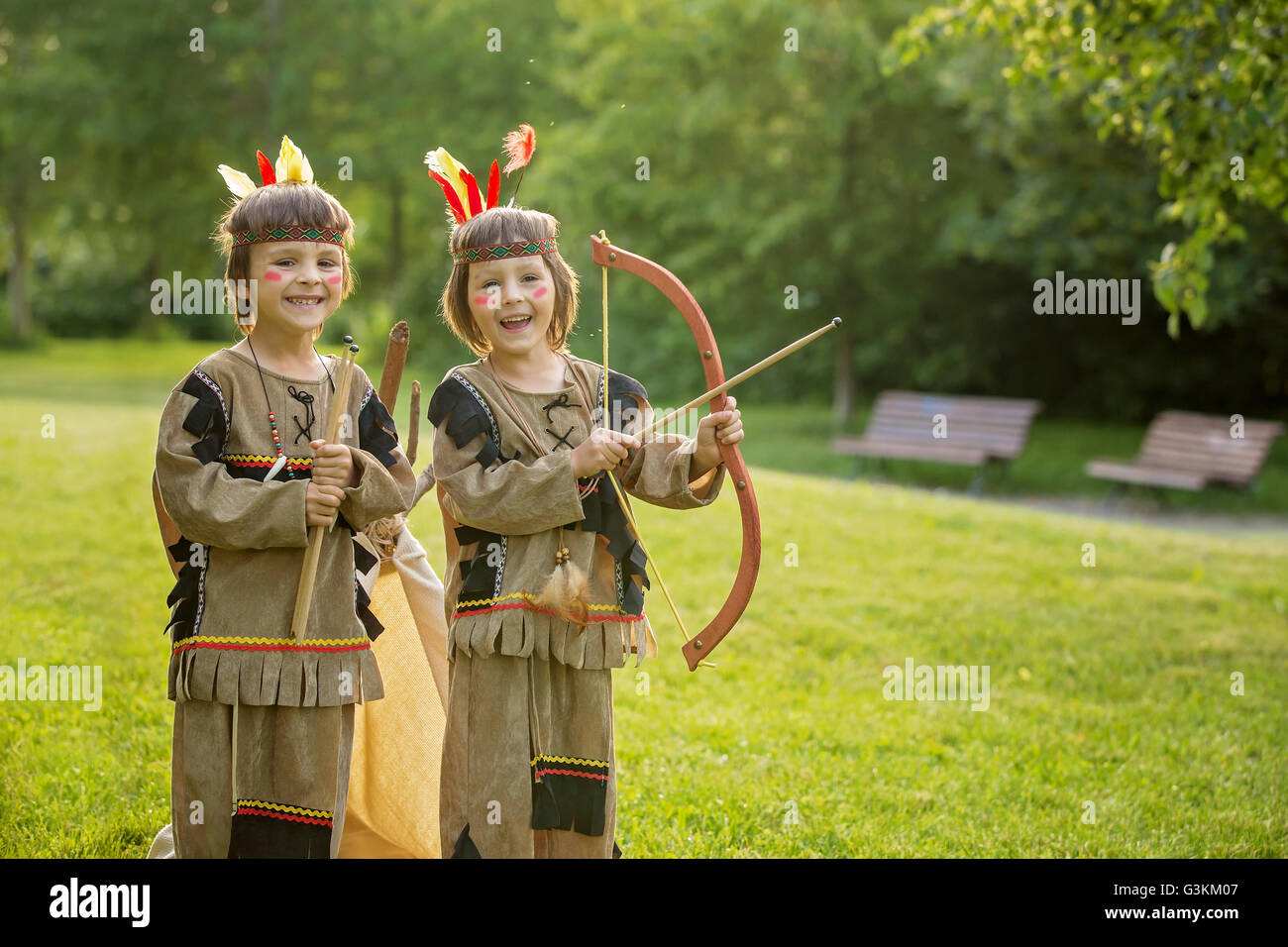 Cute portrait of native american boys with costumes, playing outdoor in ...