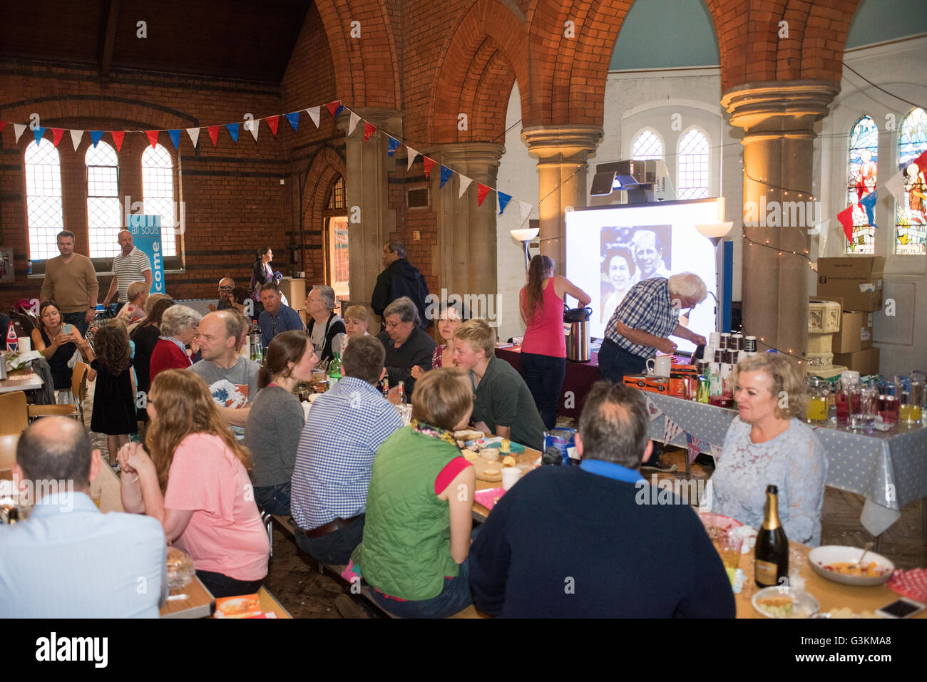 Rain meant "The Big lunch" moved inside church. Residents eating food ...