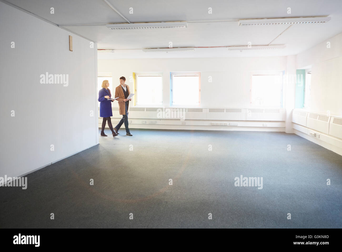Business woman walking through office hi-res stock photography and ...