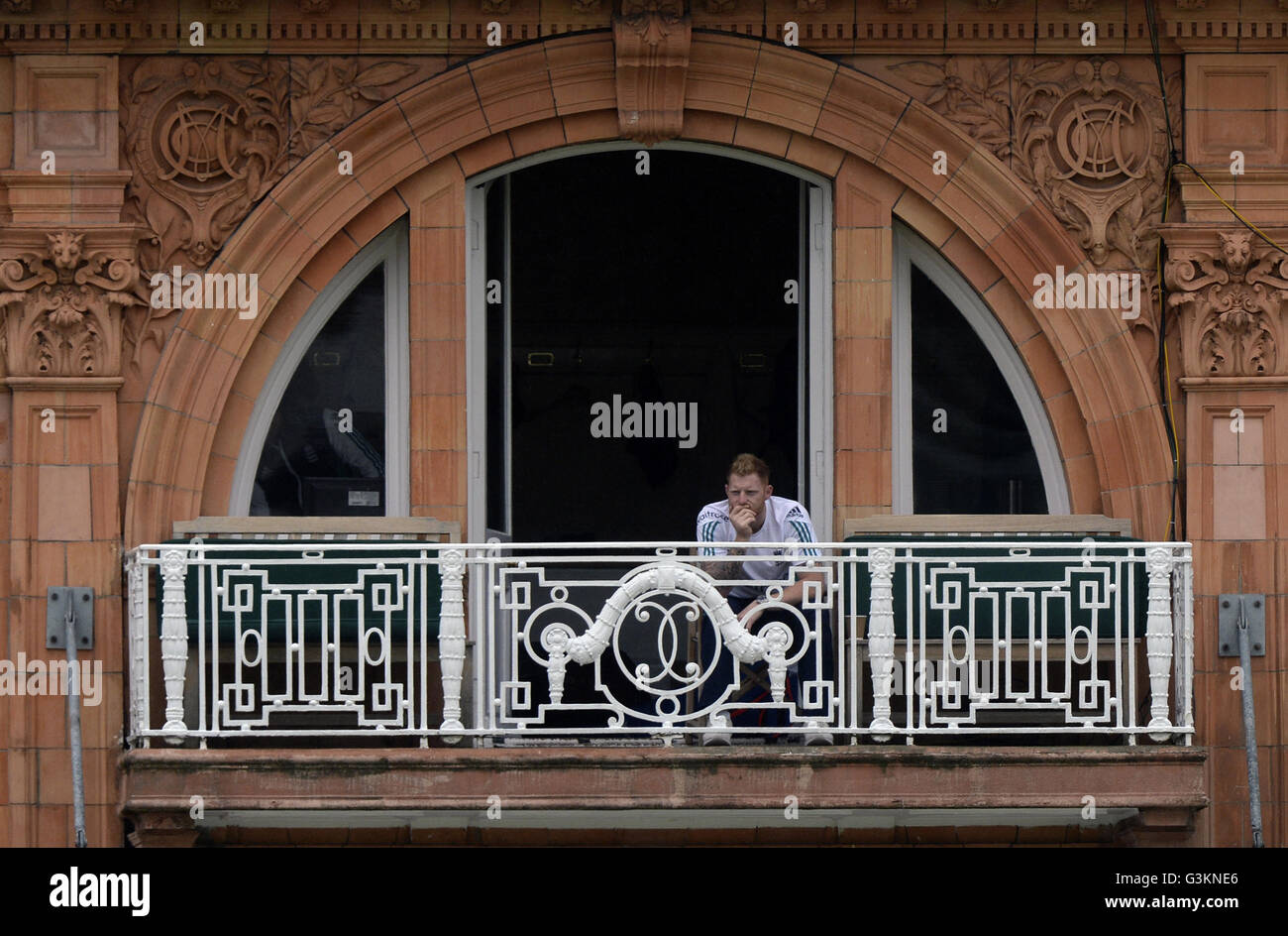 England's Ben Stokes looks-out from the dressing room as rain delays ...