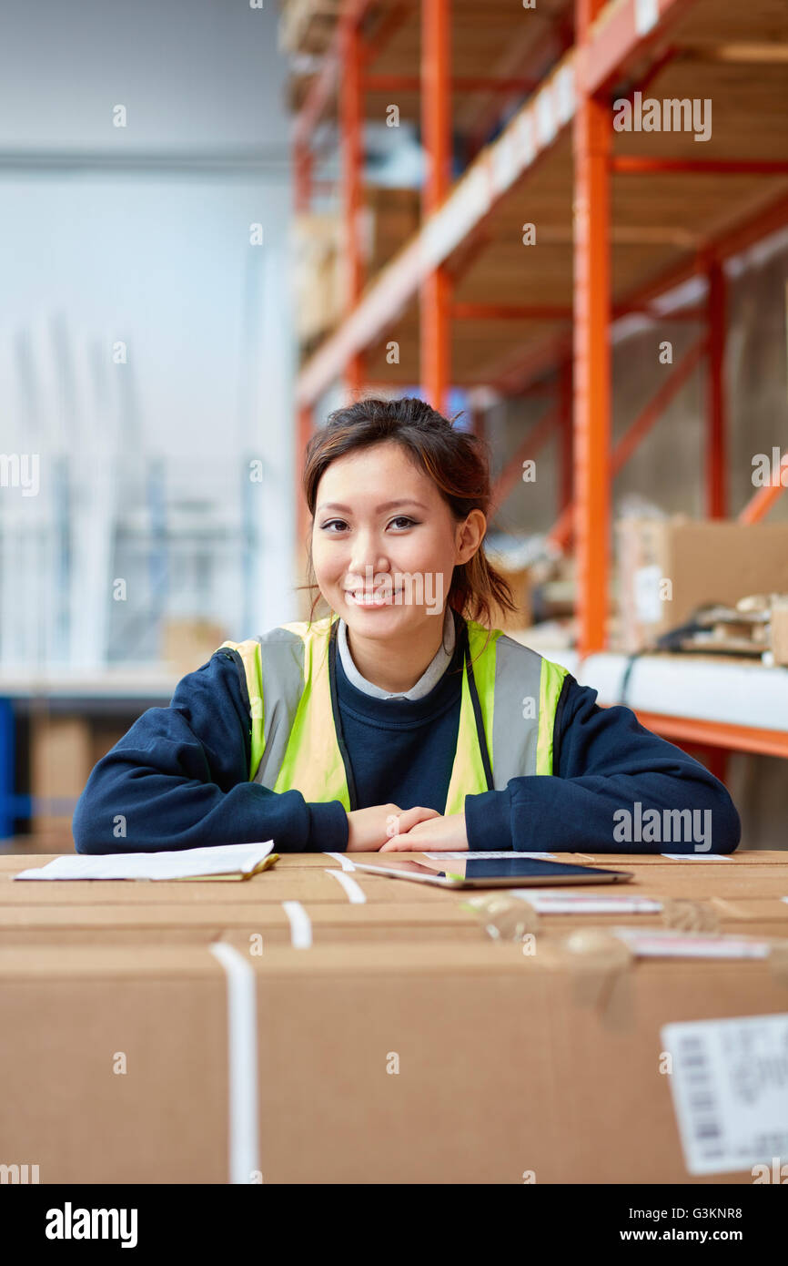 Portrait of female factory worker in factory warehouse Stock Photo - Alamy