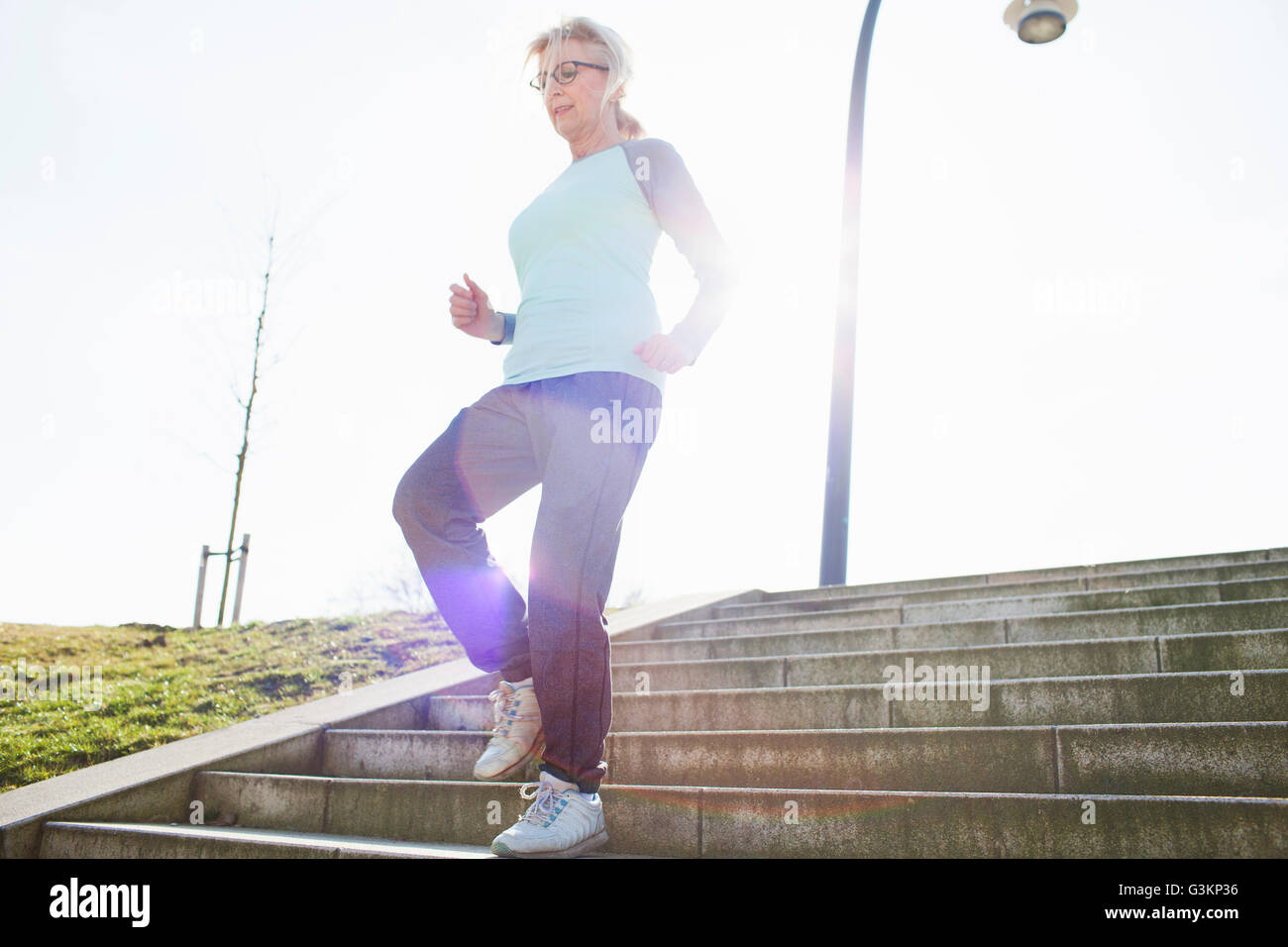 Older woman running hi-res stock photography and images - Alamy