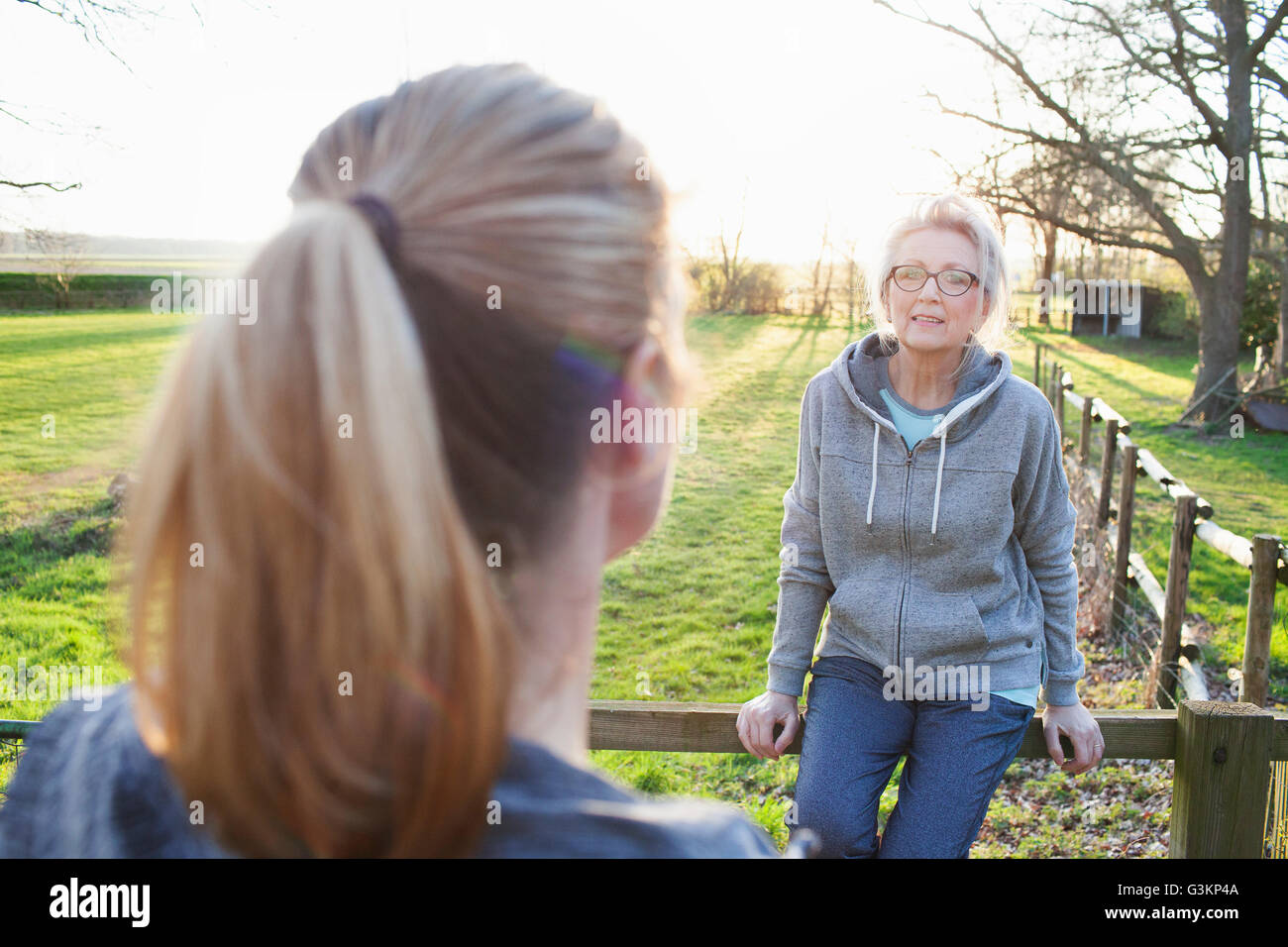 Talking Over Fence High Resolution Stock Photography and Images - Alamy