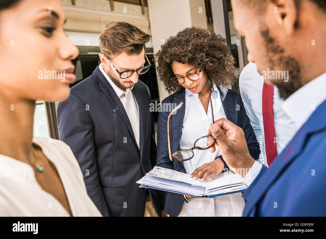 Business team preparing paperwork outside office Stock Photo - Alamy