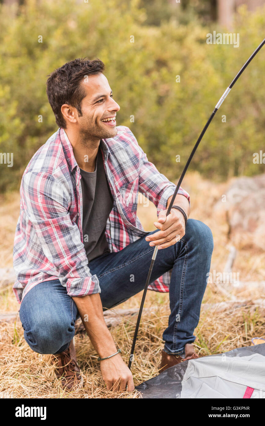 Man putting up tent hi-res stock photography and images - Alamy