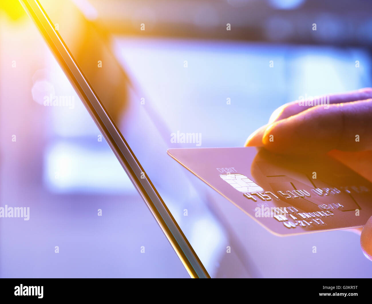 Man using his credit card online for shopping and banking with sunlight ...
