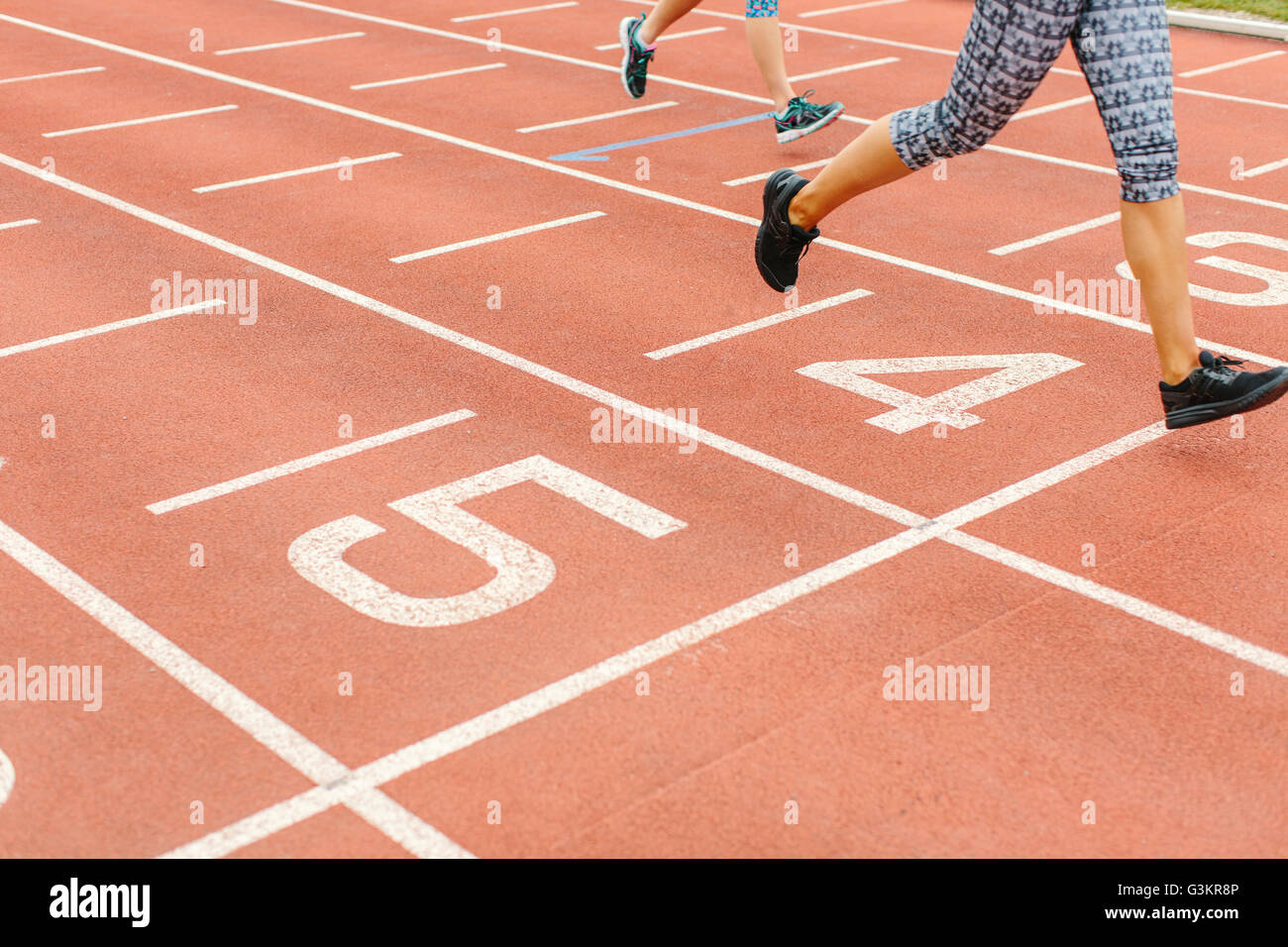 Two women on running track hi-res stock photography and images - Alamy
