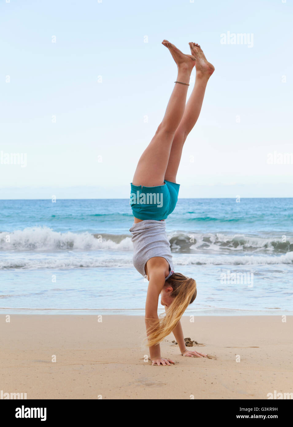 Young woman doing handstand on beach, Dominican Republic, The Caribbean Stock Photo - Alamy