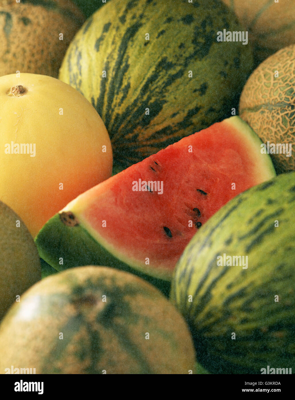 Mixed melons with sliced watermelon, close-up Stock Photo - Alamy