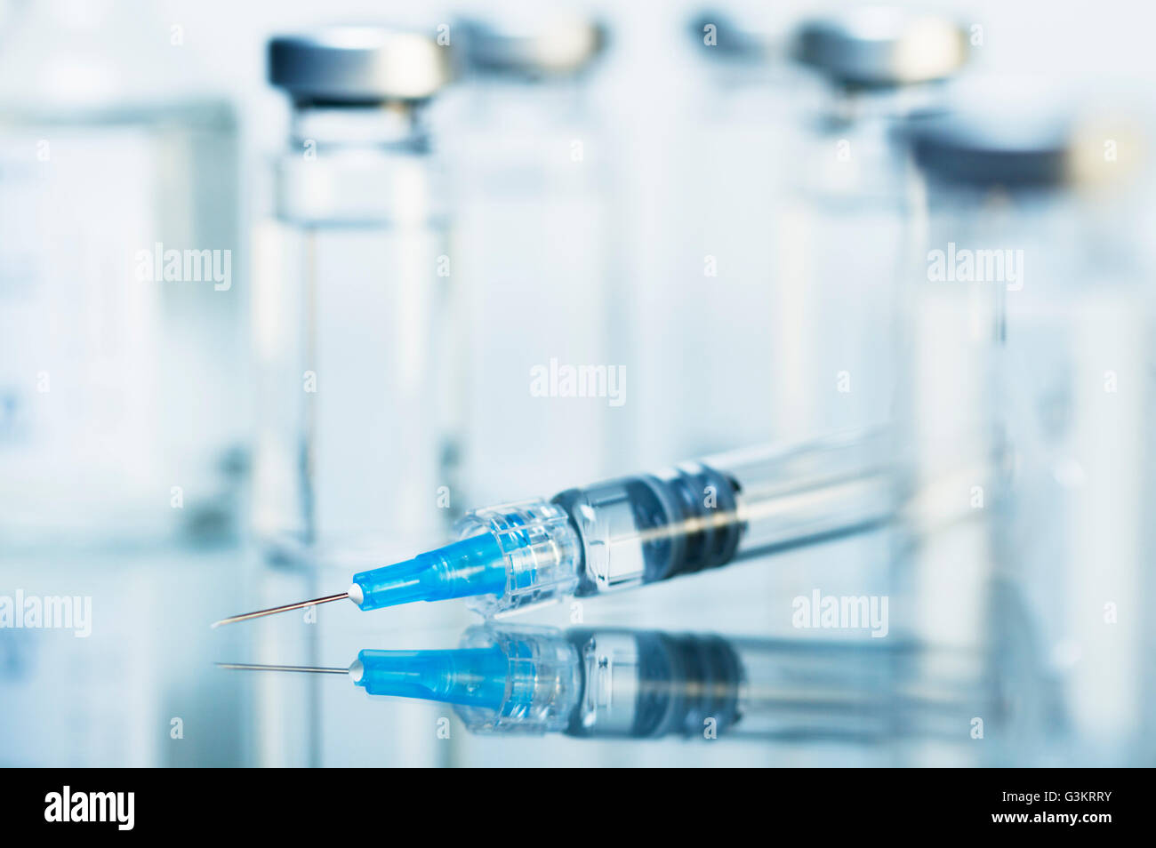 Syringe. Disposable plastic medical syringe surrounded by sealed ...