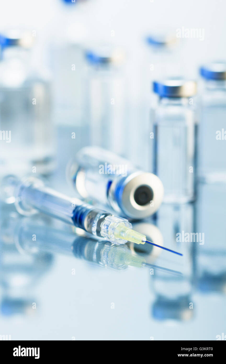 Syringe. Disposable plastic medical syringe surrounded by sealed ...