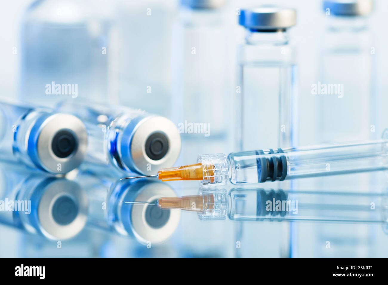 Syringe. Disposable plastic medical syringe surrounded by sealed ...