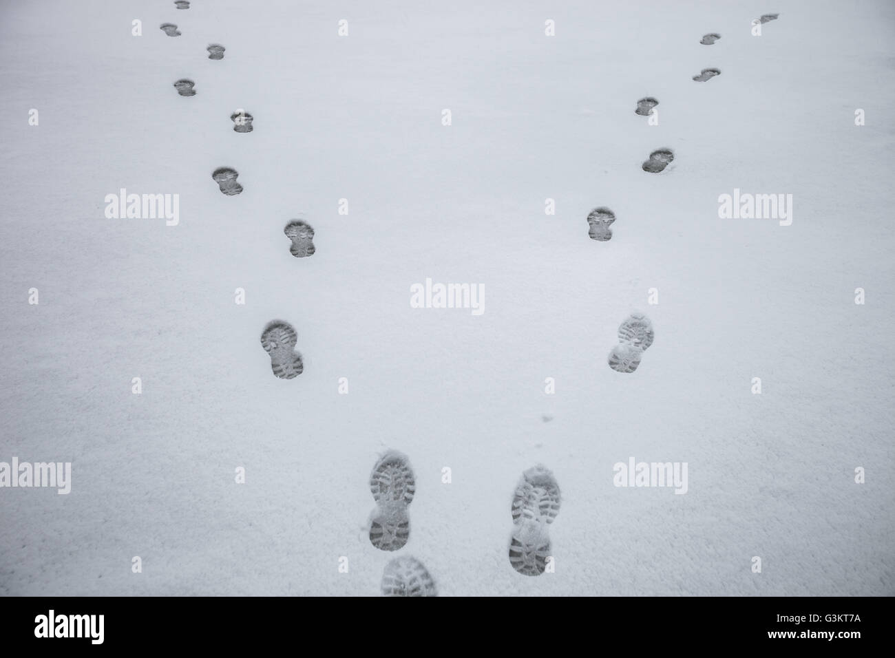 Footprints in snowy landscape Stock Photo - Alamy