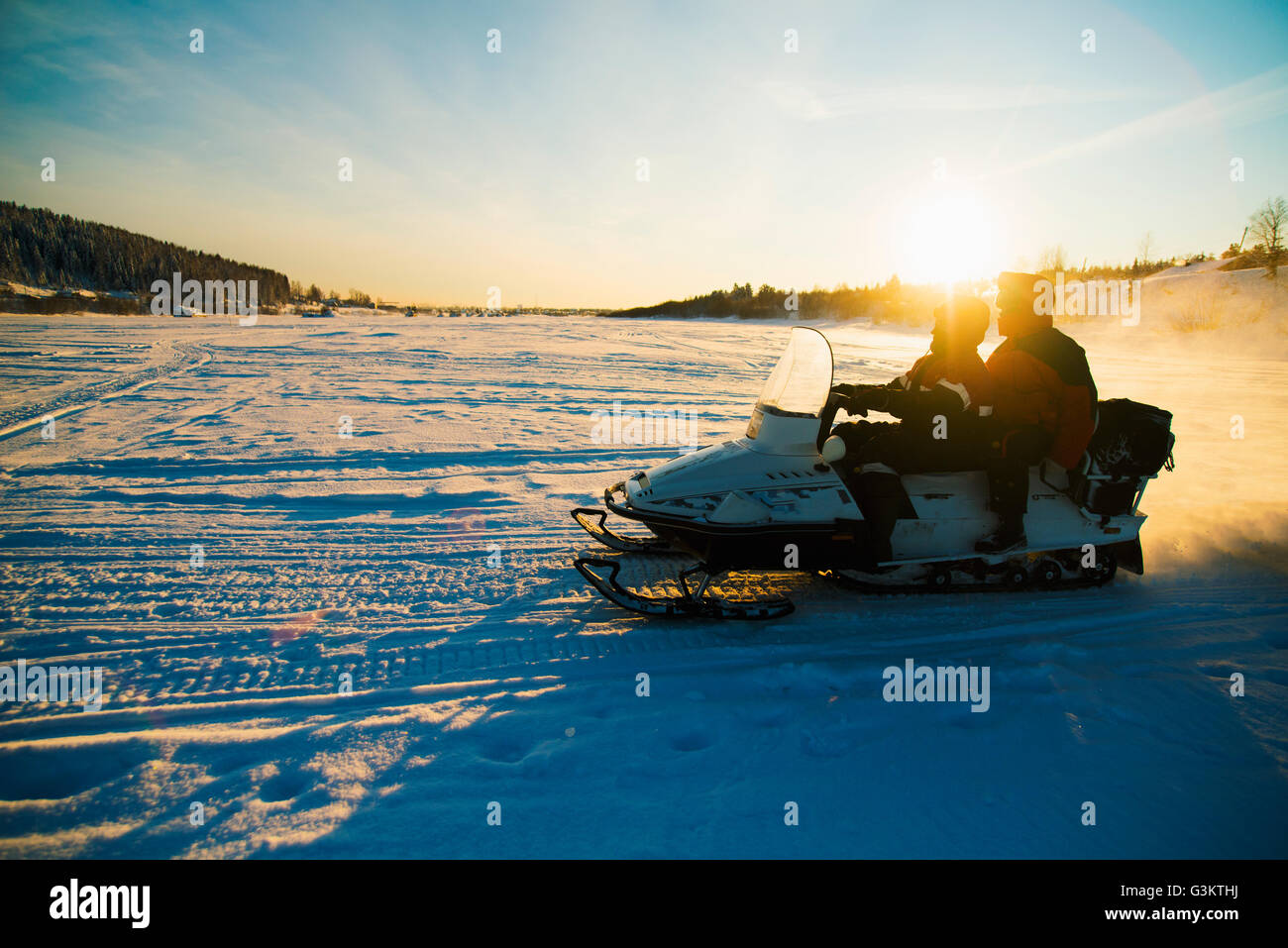 Young people on snowmobile hi-res stock photography and images - Alamy