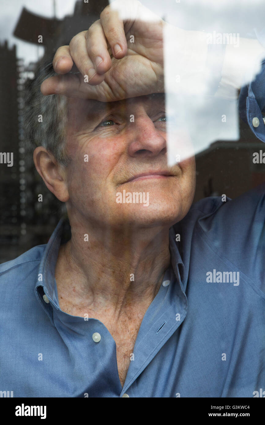Man leaning on window hi-res stock photography and images - Alamy