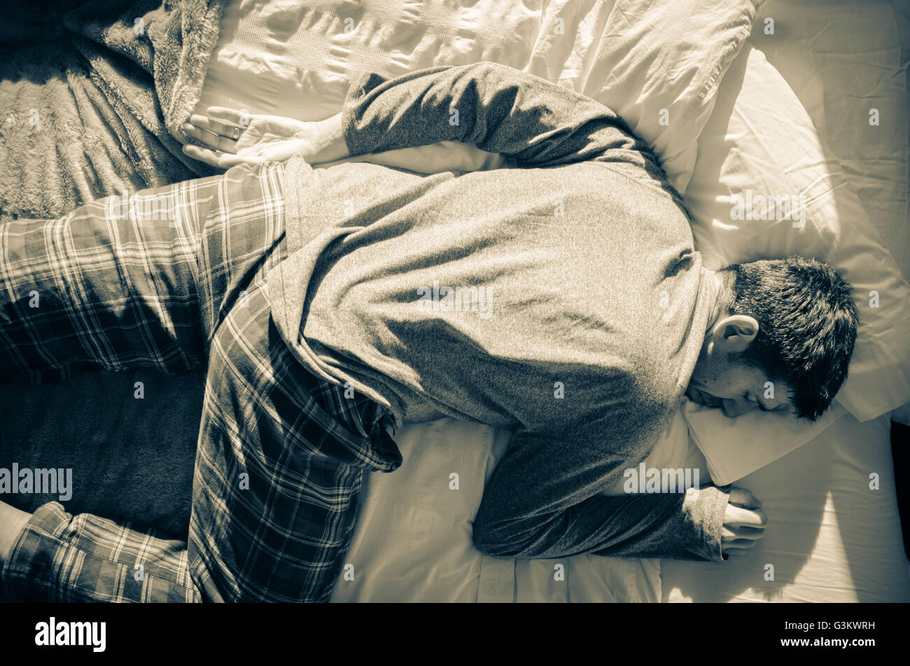 Man sleeping on bed Stock Photo - Alamy