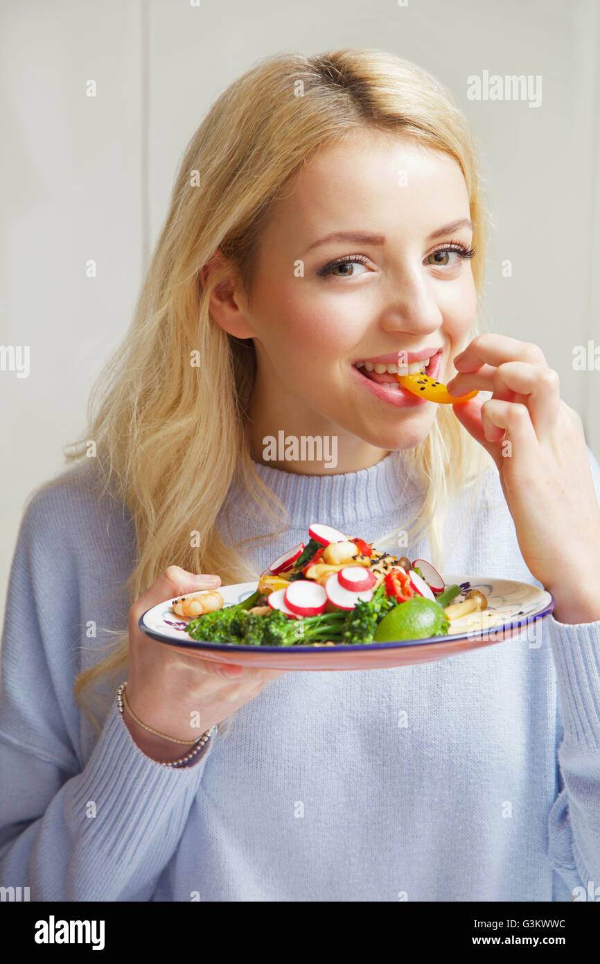 Woman eating plate vegetables hi-res stock photography and images - Alamy